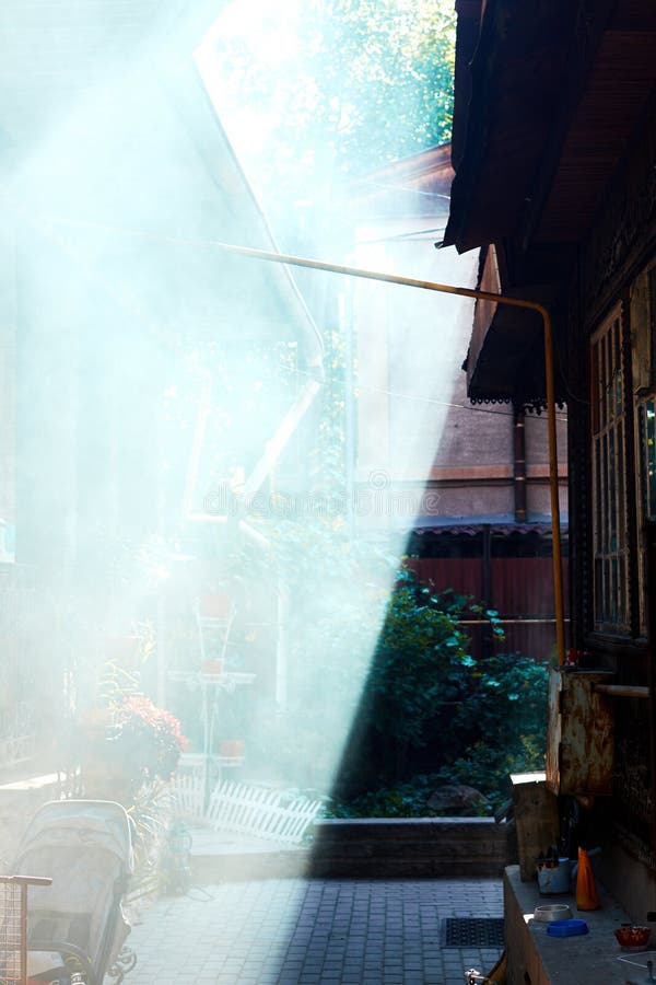 Smoke Covering the Courtyard and the Rays of the Sun Stock Photo ...