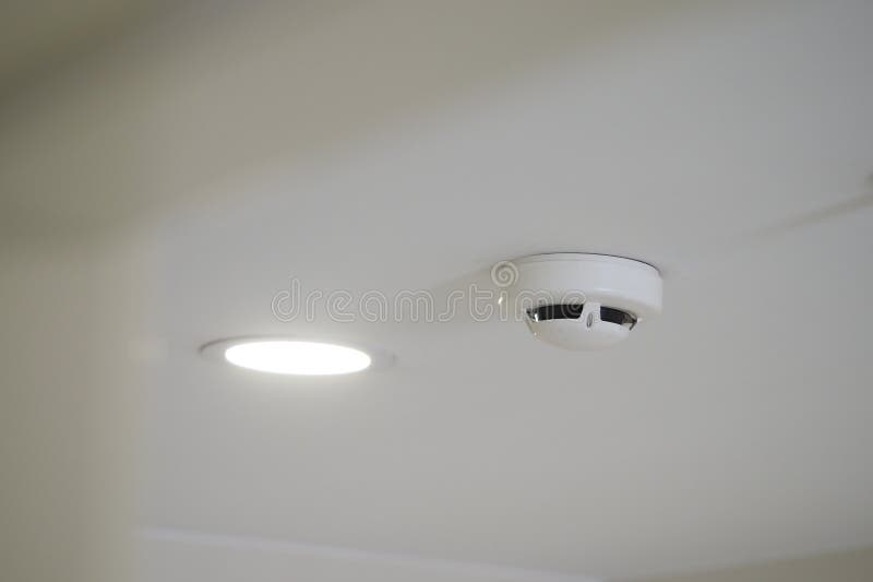 Smoke Detector and Ceiling Light Installed in Modern Room Stock Image ...