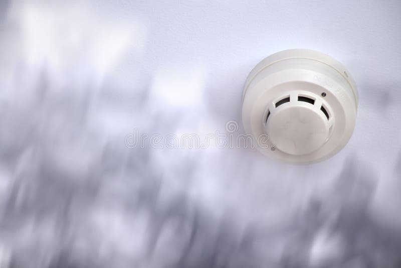 A Smoke Detector Installed at a Ceiling with Smoke Stock Photo - Image ...
