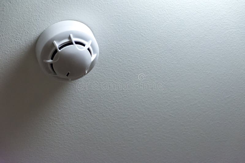 Smoke Detector with Plastic Cap Cover Mounted on Ceiling of the ...