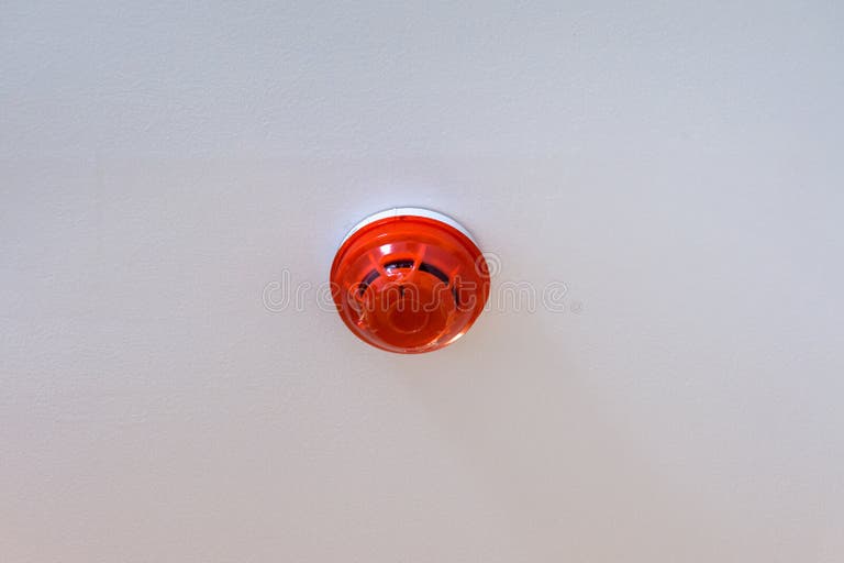 Smoke Detector with Plastic Cap Cover Mounted on Ceiling of the ...
