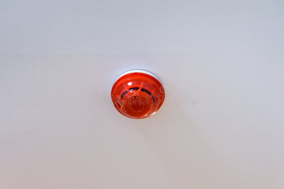 Smoke Detector with Plastic Cap Cover Mounted on Ceiling of the ...