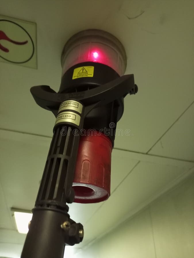 Smoke detector test. editorial stock image. Image of alarm - 263257839