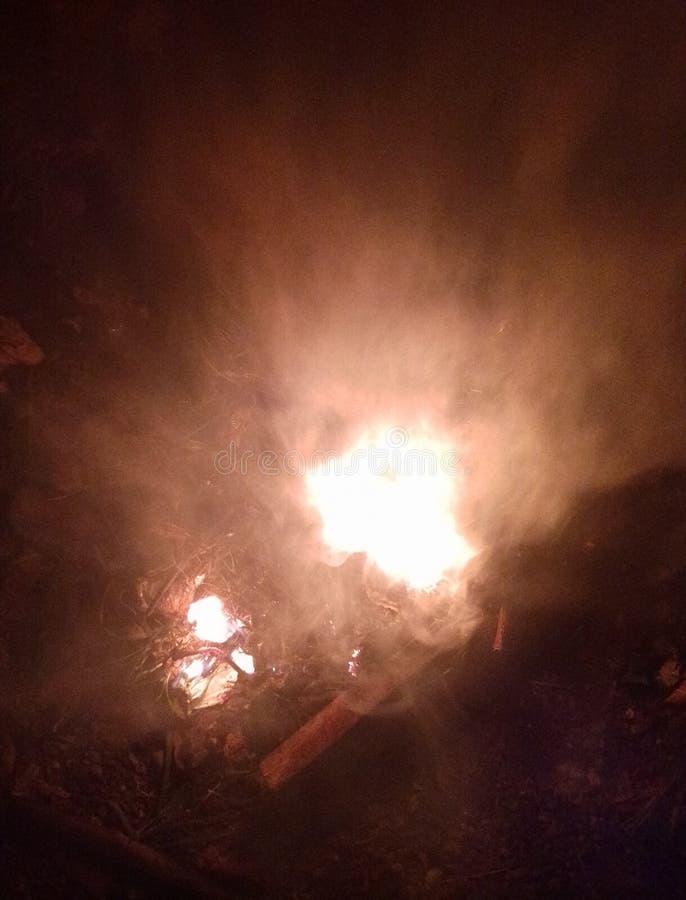 Smoke emitting fire stock photo. Image of bonfire, lighting - 261786126