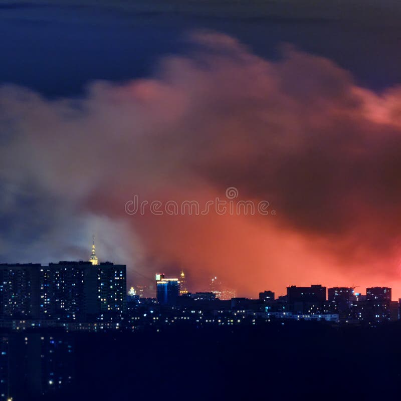 Smoke and Fire Over the Night City. Building is Burned and Collapsed ...