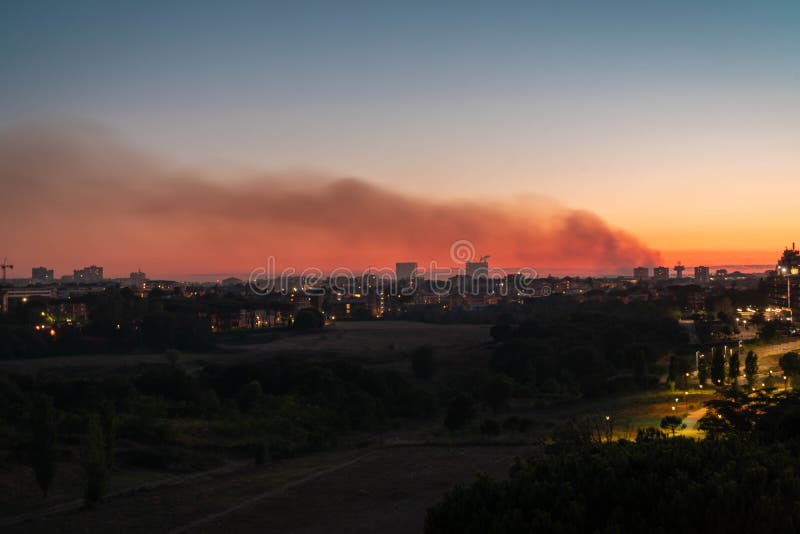 Smoke from a Fire Over a Night City on a Sunset Sky in Rome, Italy ...