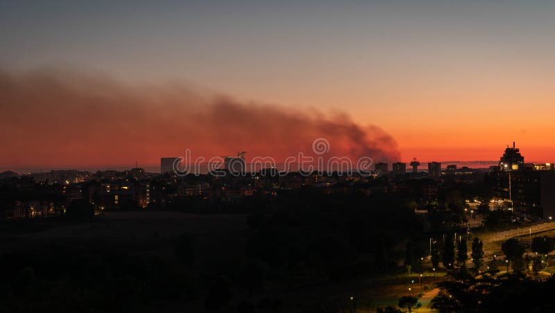 Smoke from a Fire Over a Night City on a Sunset Sky in Rome, Italy ...