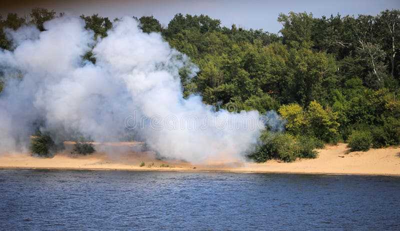 Smoke and Fire on the River Bank Stock Photo - Image of lake, forest ...