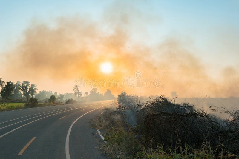 Smoke and Fire on the Rural Road Stock Photo - Image of highway, fire ...