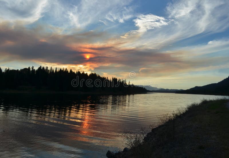 Smoke Over the Water stock image. Image of danger, land - 92897757