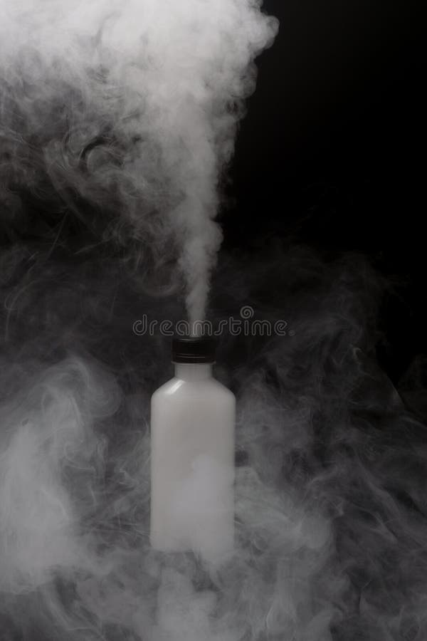 Smoke Pouring Out of Small Plastic Bottle Creating Unique Shapes and ...