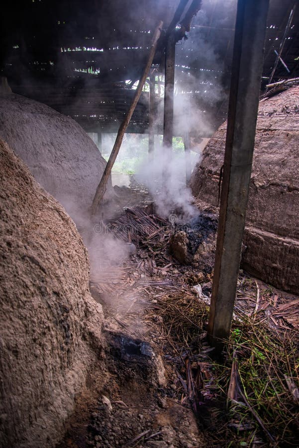 Smoke Rises from Burning Wood Inside a Traditional Charcoal Kiln ...
