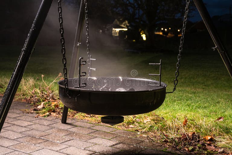 Smoke Rising from a Hanging Fire Pit.. Stock Image - Image of damage ...