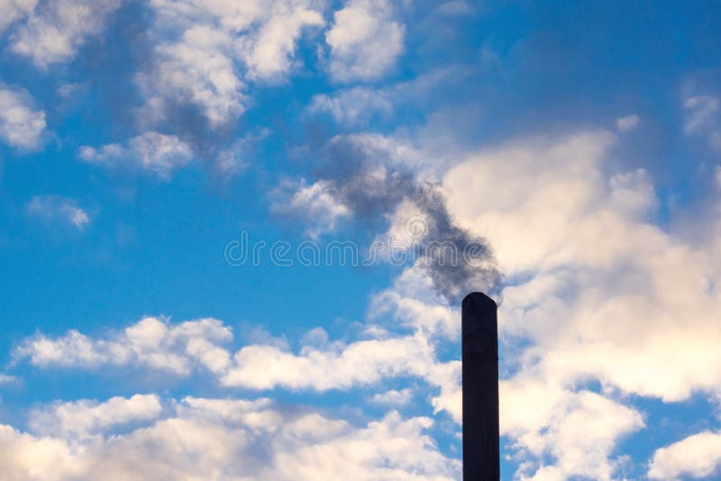Smoke rising from a stack stock image. Image of industrial - 69948039