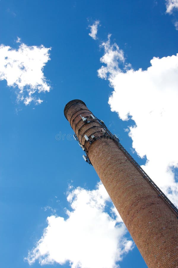 Smoke Stack Rises into Blue Sky Stock Photo - Image of antenna, spire ...