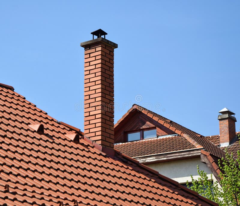 Smoke stacks on the roof stock photo. Image of building - 59454238