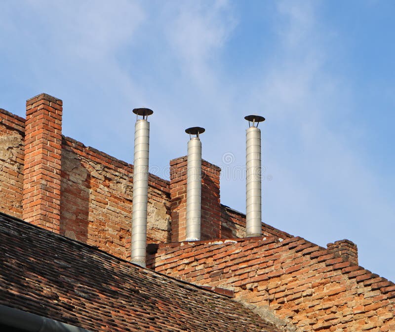 Smoke Stacks on the Roof of a House Stock Photo - Image of metal ...
