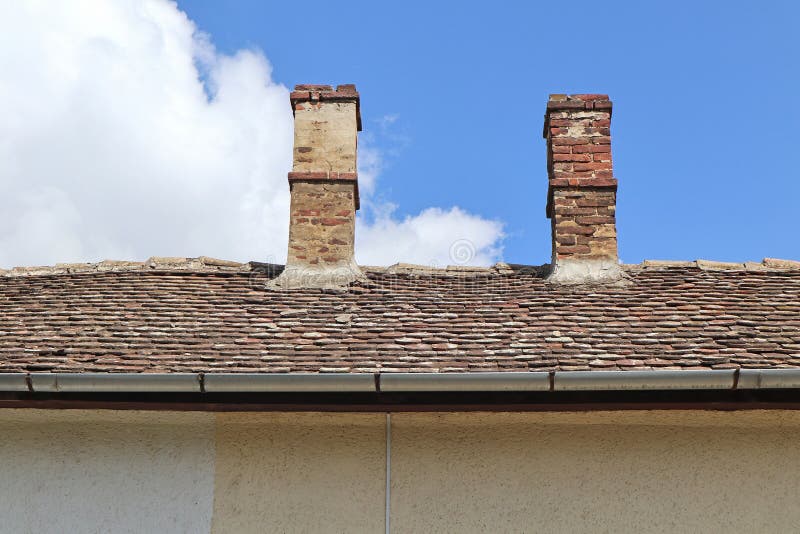 Smoke Stacks on the Roof of an Old Building Stock Photo - Image of roof ...