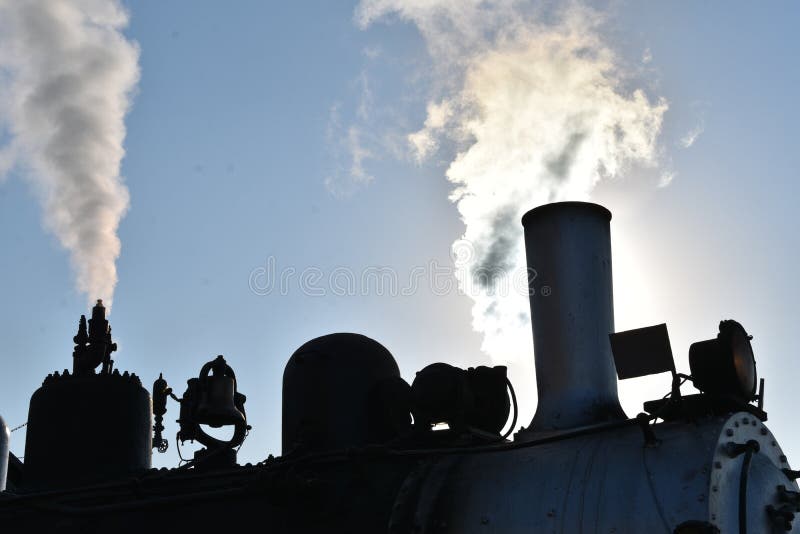 Smoke and Steam are Released from the Engine of an Old Train Locomotive ...