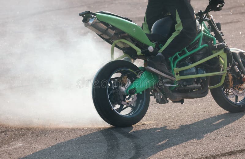 Smoke from Under the Wheel of a Motorcycle Stock Photo - Image of ...