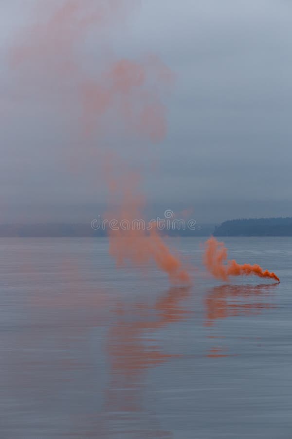 Orange Smoke Flare In The Water Stock Image - Image of distress, smoke ...