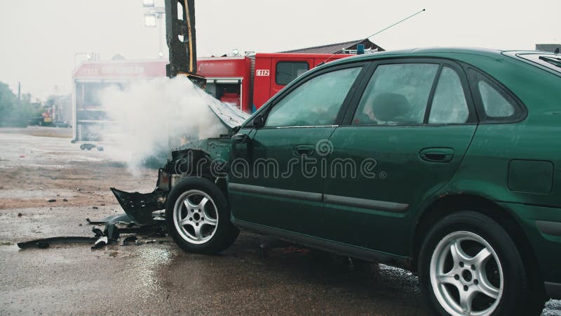 Smoke from Wrecked Car with Fire Engine in the Background. Car Accident ...