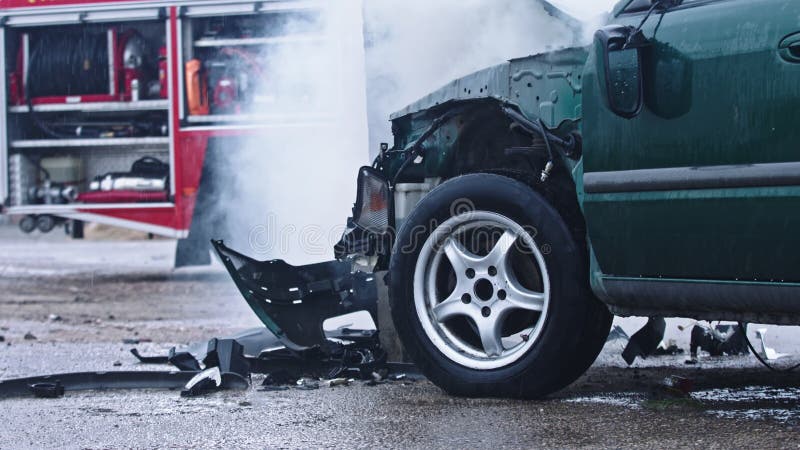 Smoke from Wrecked Car with Fire Engine in the Background. Car Accident ...