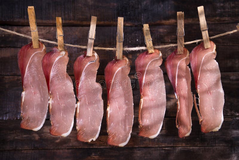 Smoked bacon hanging stock photo. Image of tasty, slice - 64146820