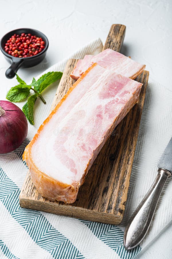 Smoked Bacon, Whole Slab with Herbs on White Background Stock Photo ...
