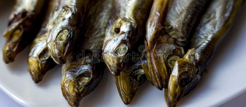 Smoked Capelin on a Plate Closeup, Dried Fish Stock Photo - Image of ...