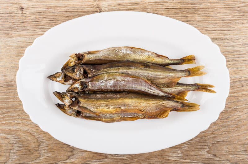 Smoked Capelin in White Dish on Wooden Table Stock Image - Image of ...