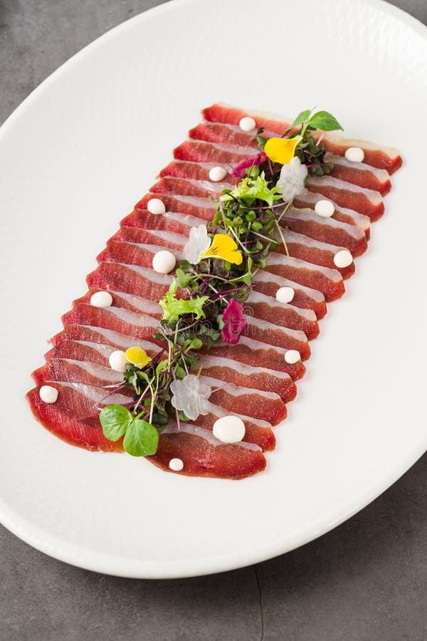 Smoked Duck Pastrami in White Porcelain Plate on Stone Table Stock ...