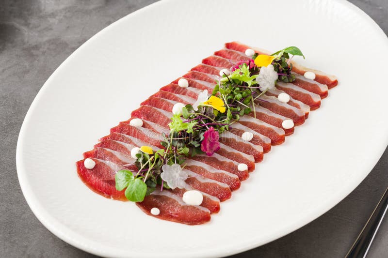 Smoked Duck Pastrami in White Porcelain Plate on Stone Table Stock ...