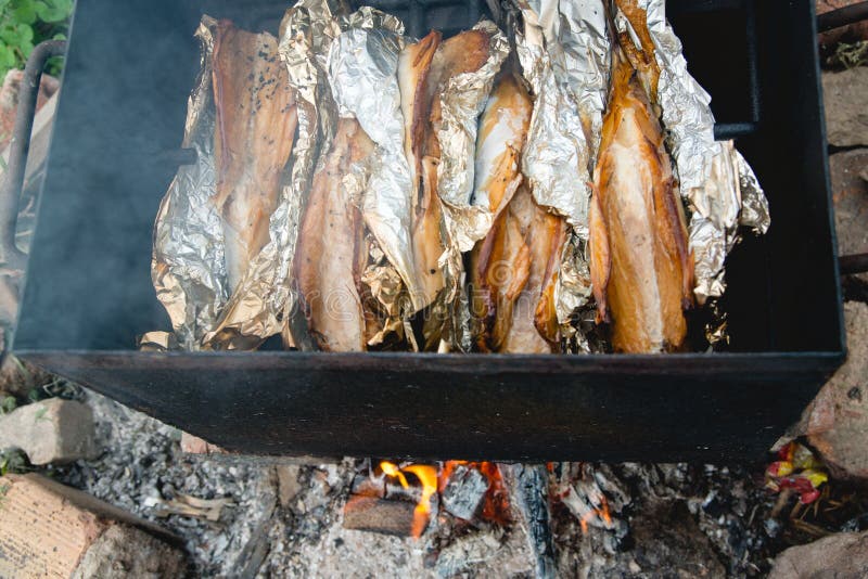 Cooking Fish Over Open Fire Stock Photo - Image of bass, freshwater ...