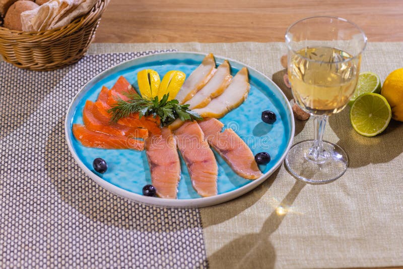 Smoked Fish Platter Appetizer on the Wooden Table. Stock Photo - Image ...