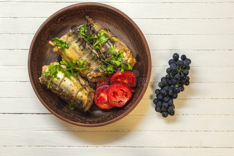 Smoked Fish with Vegetables in Takrelke with Grapes Stock Photo - Image ...