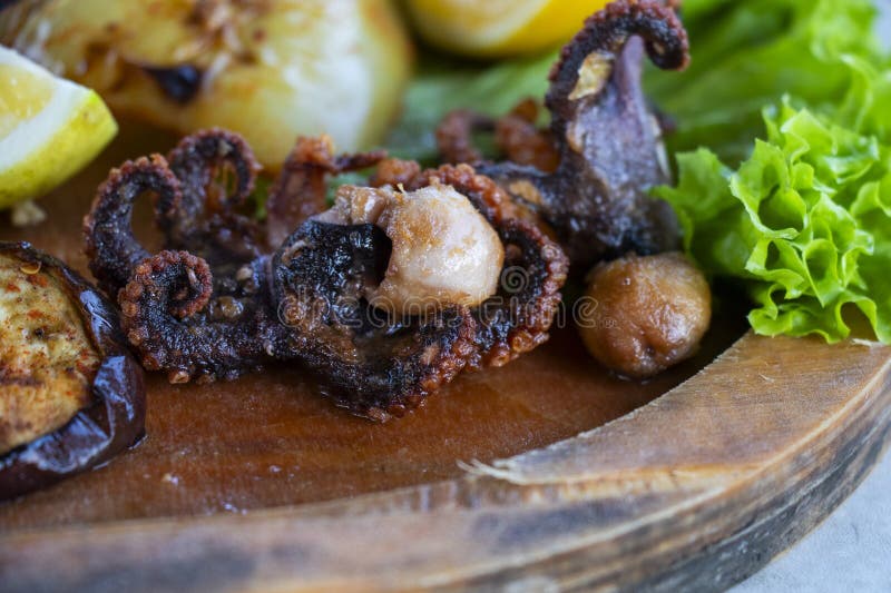 Smoked and fried octopus stock image. Image of dish - 342744463