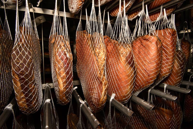 Smoked Ham Hanging in Industrial Cell Stock Photo - Image of italian ...