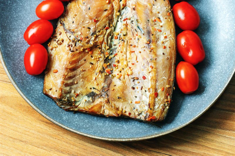 Smoked Mackerel Fish Fillet with Mini Tomatoes on a Plate Stock Image ...