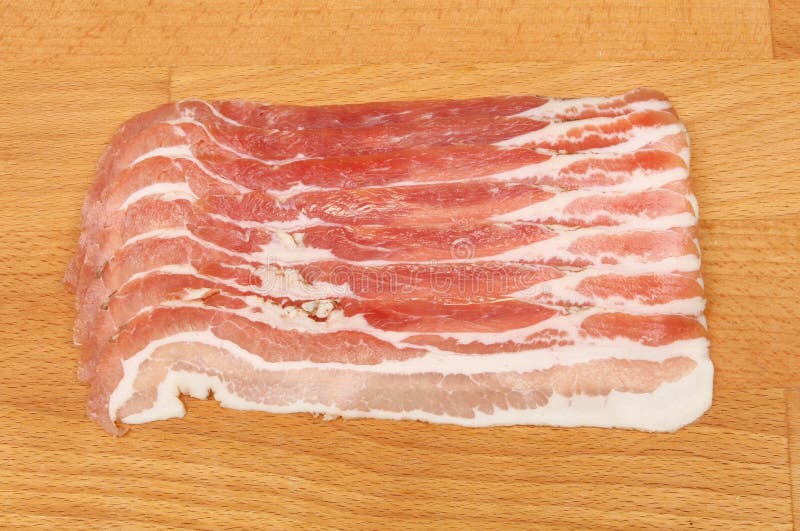 Smoked pancetta on a board stock image. Image of ingredient - 95737029