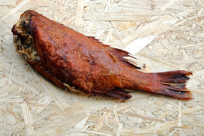 Smoked pike on the Board stock photo. Image of lunch - 94324824