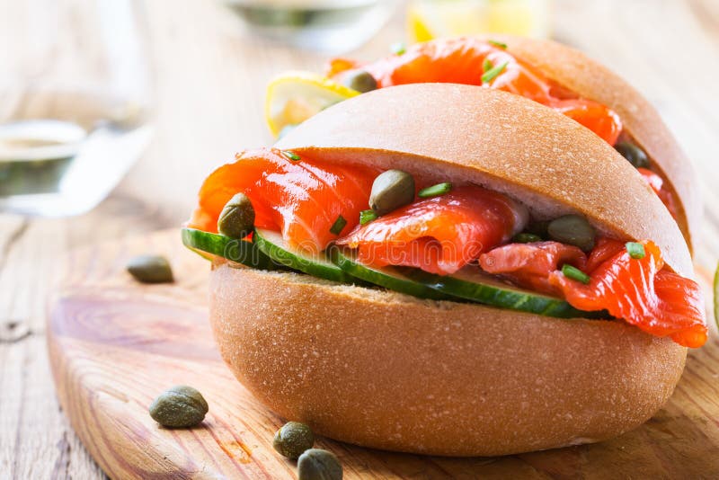 Smoked salmon bun sandwich stock photo. Image of closeup - 69489628