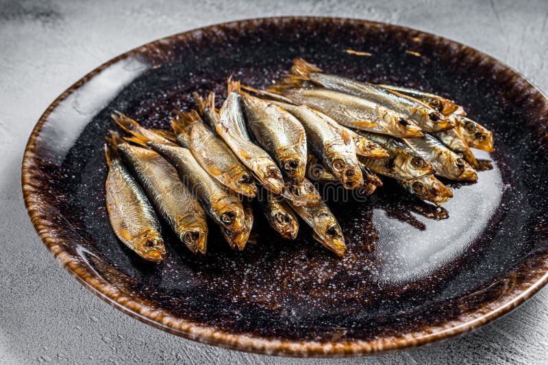 Smoked Sprat Fish in Rustic Plate. White Background Stock Image - Image ...