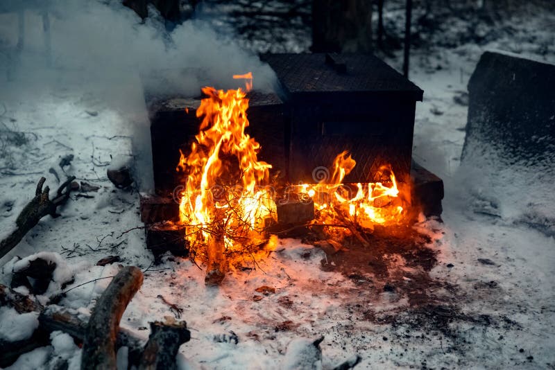 Smokehouse on Fire. Cooking on a Fire in the Fresh Air in Winter Stock ...