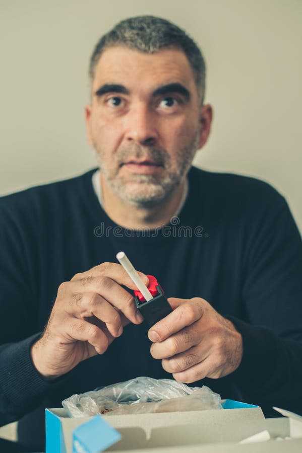 Smoker Man Roll Tobacco Cigarettes Using Rolling Machine Stock Image ...