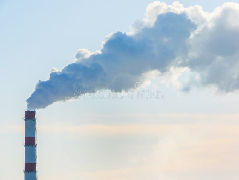 Chimney with Thick Smoke Against a Background of Light Blue Sky. Stock ...
