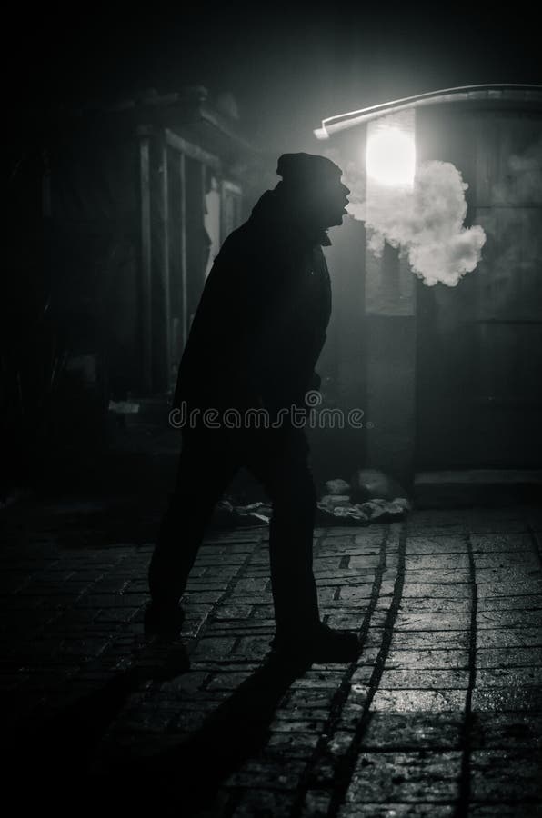 Smoking alone at night stock image. Image of male, face - 149561201