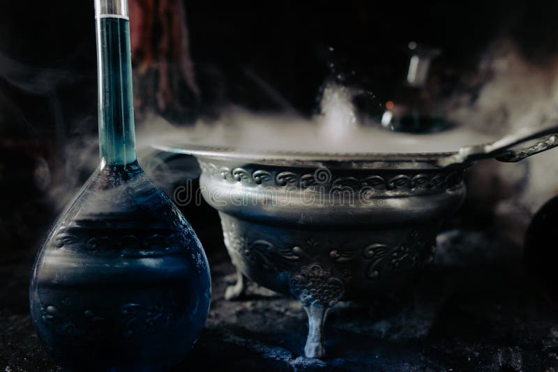 A blue Magic Potion stock photo. Image of table, darkness - 259259928
