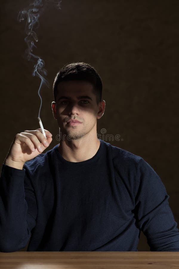 Smoking a cigarette stock photo. Image of alone, frustration - 63273900