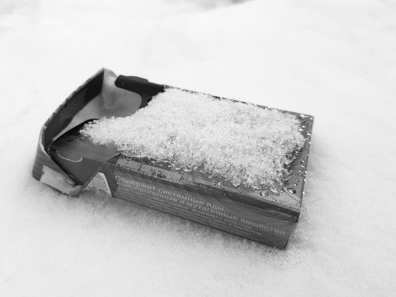 Smoking - Cigarette Pack in the Snow in Winter Editorial Photo - Image ...